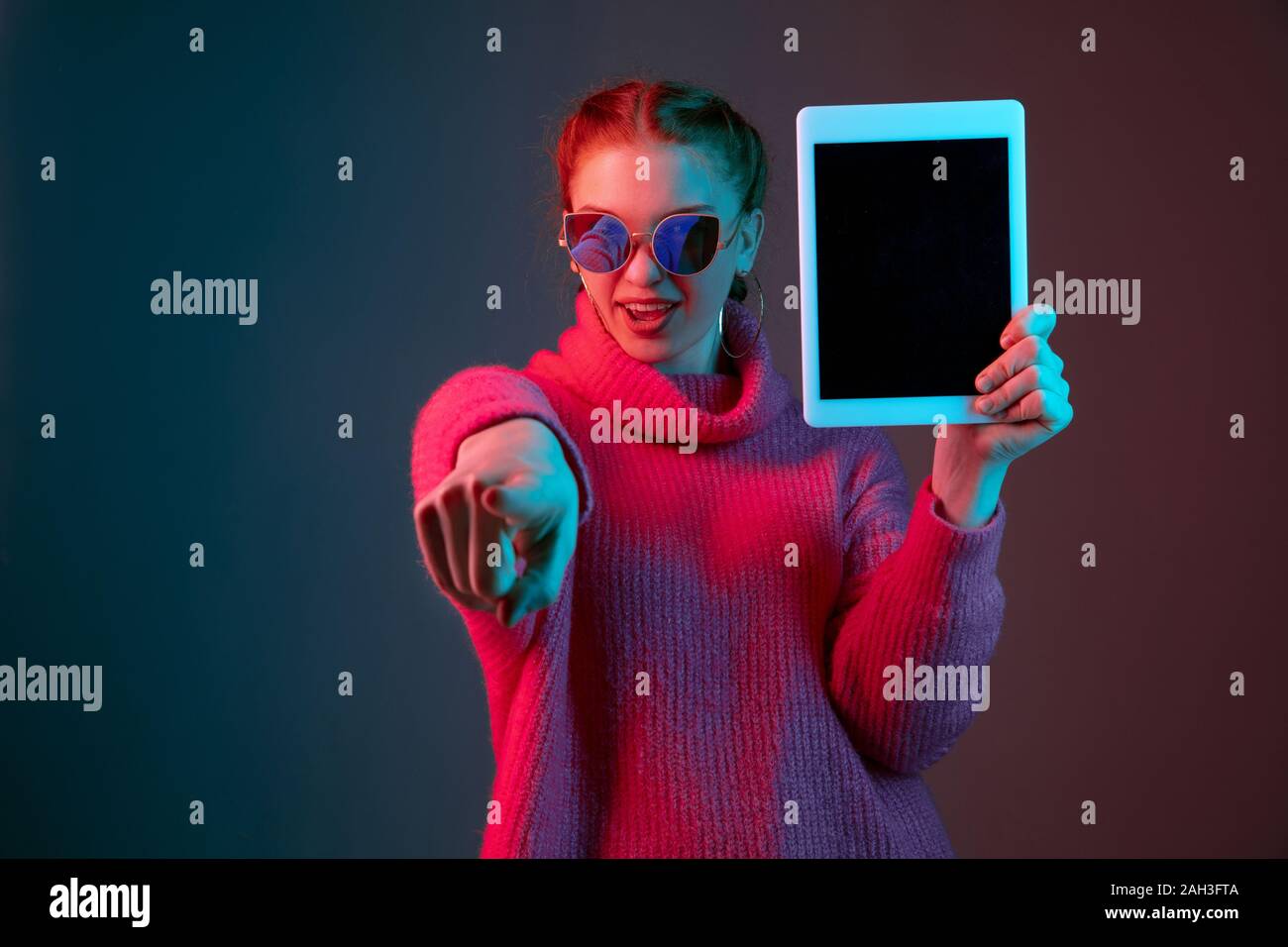 Showing blank tablet screen. Caucasian woman's portrait isolated on ...