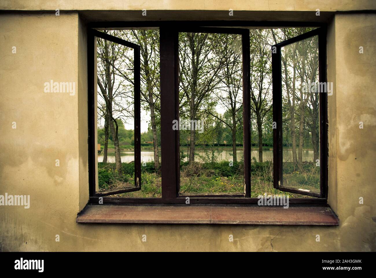 open windows of a house with a view on a lake with trees Stock Photo ...