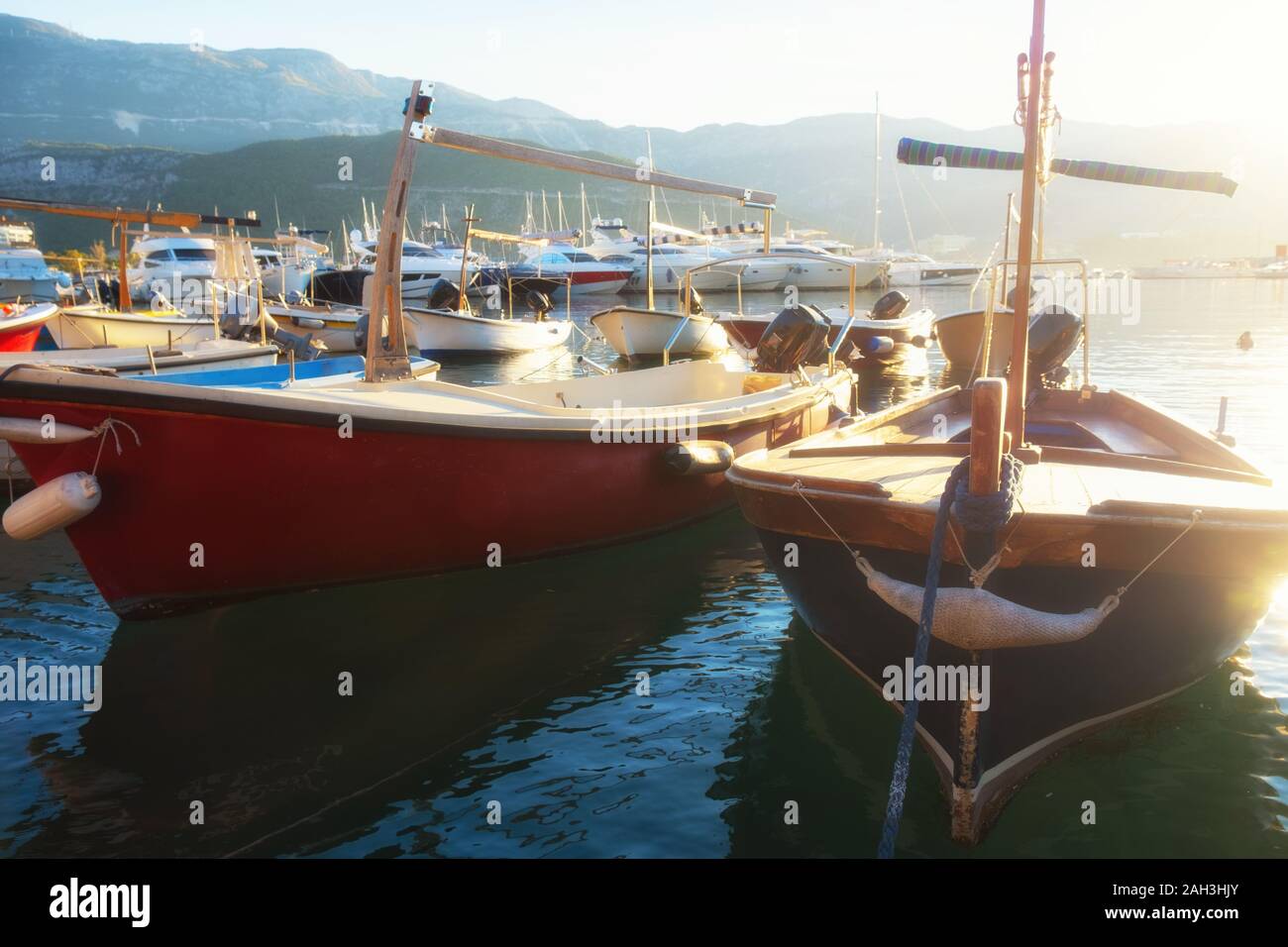 Traditional wooden boats in the harbor at mediterranean city marina ...