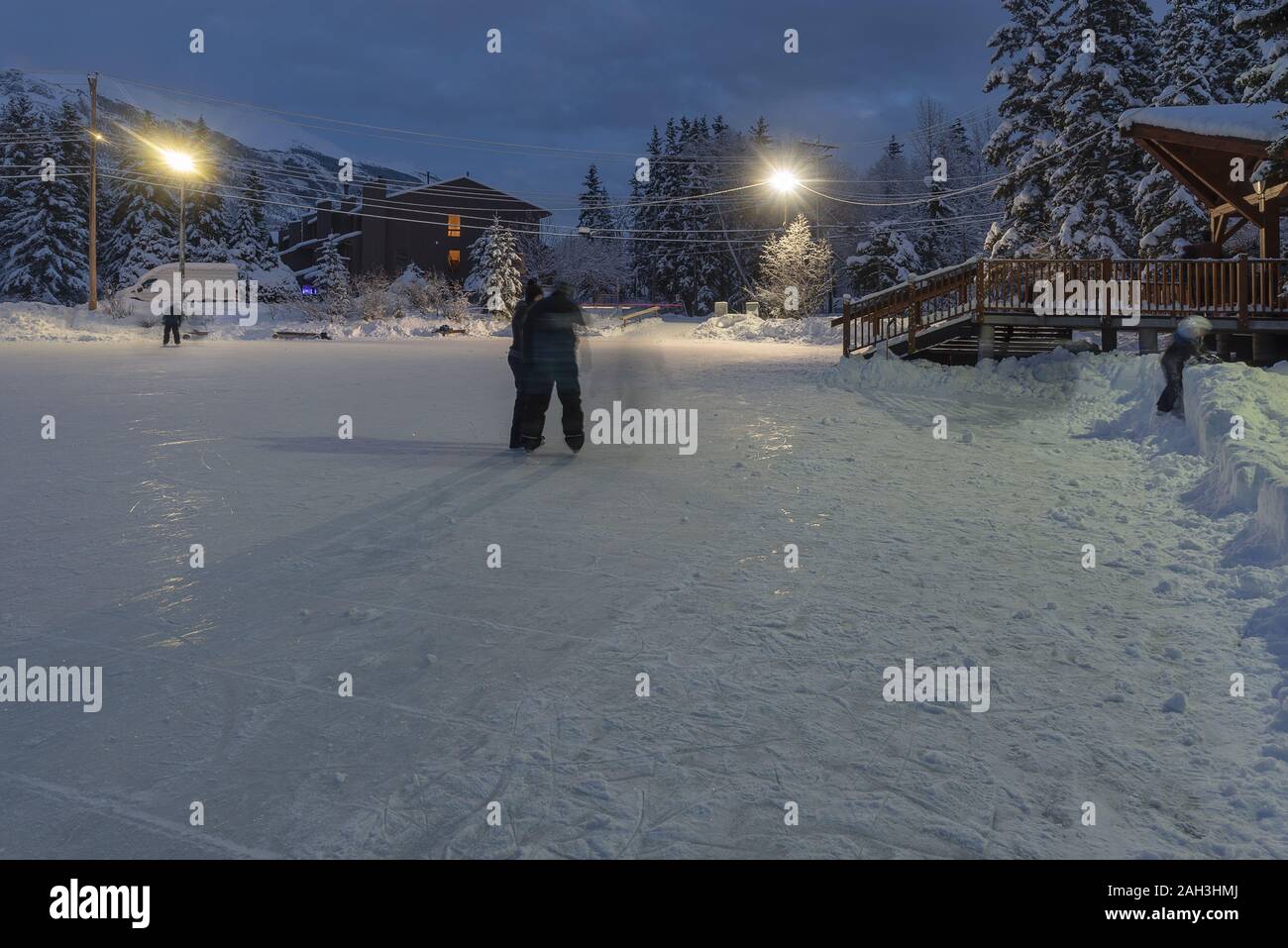 Pond Skating at Night in Canmore, Alberta, Canada Stock Photo - Alamy
