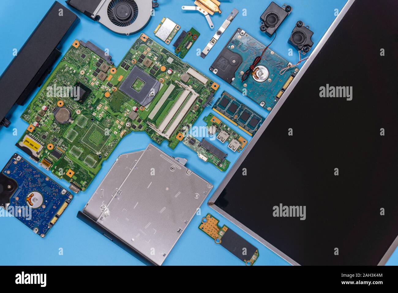 Parts of a modern computer. The insides of a laptop on a blue ...