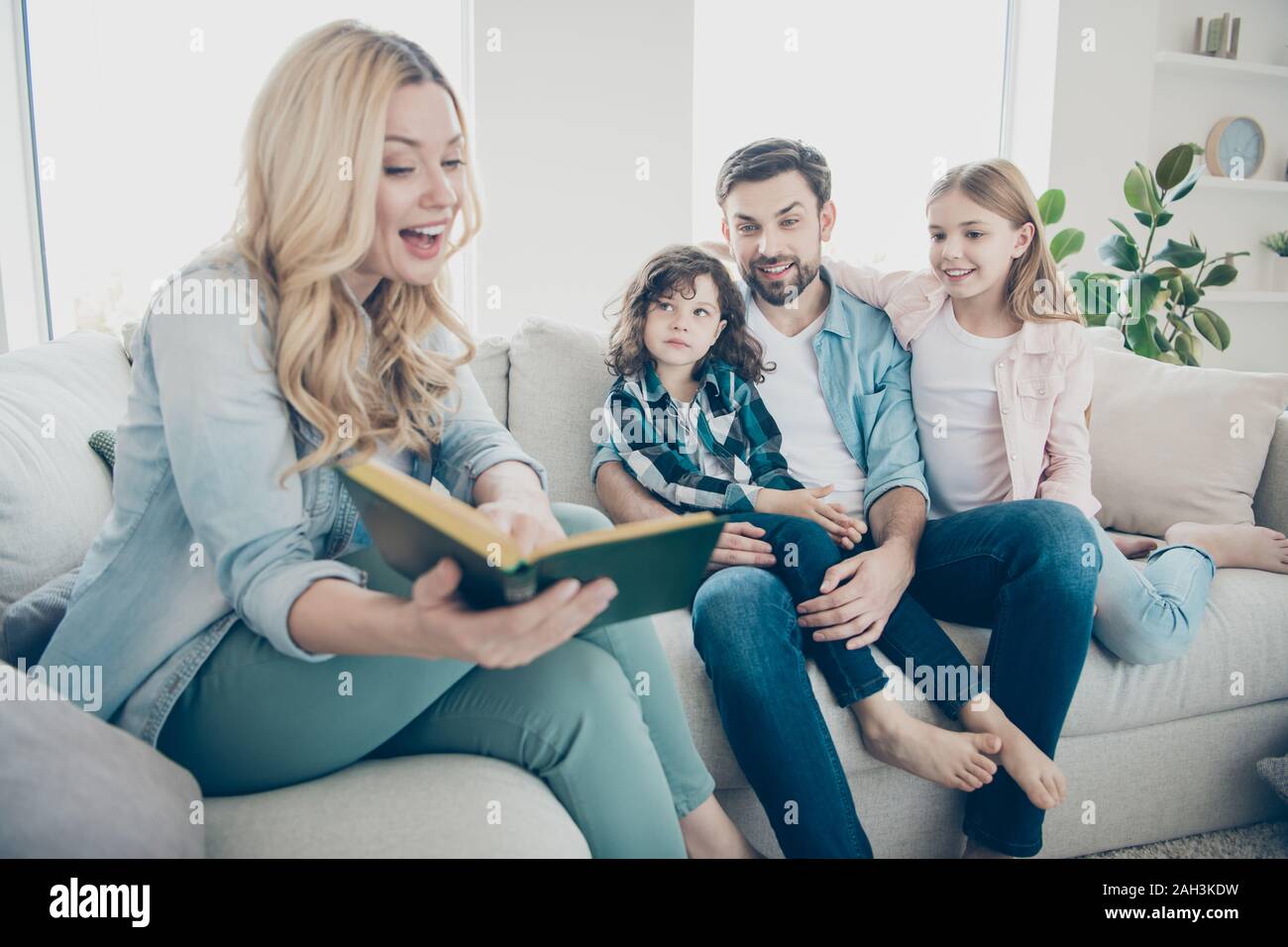 Photo of big family two children comfortable sit sofa listening mommy ...