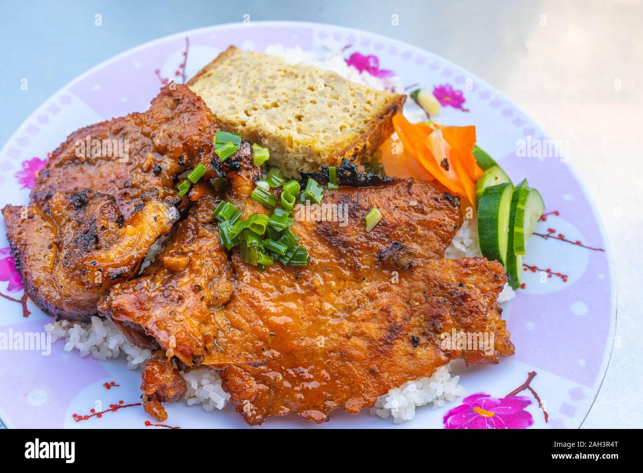 Delicious Vietnam grilled pork chop rice- Com Tam Stock Photo - Alamy
