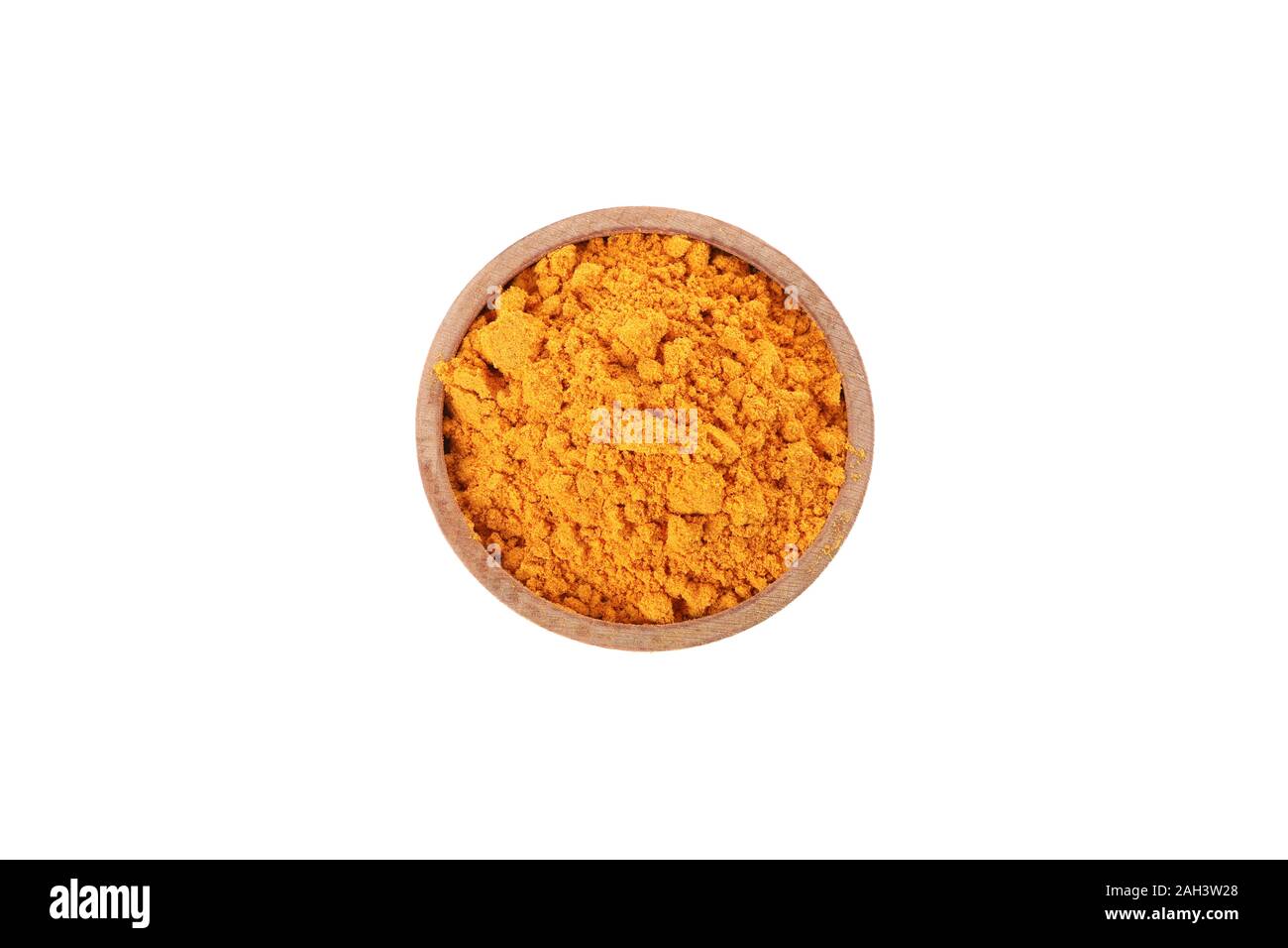 Fragrant turmeric powder in wood bowl isolated on white background ...