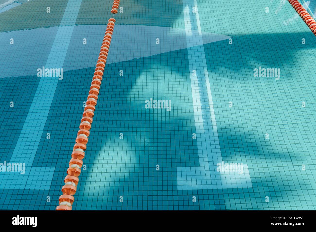 Top view of cyan swimming pool. Blue pool with sunlight in campus of a ...