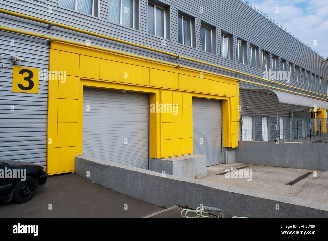 Yellow Gate for loading warehouse Stock Photo - Alamy