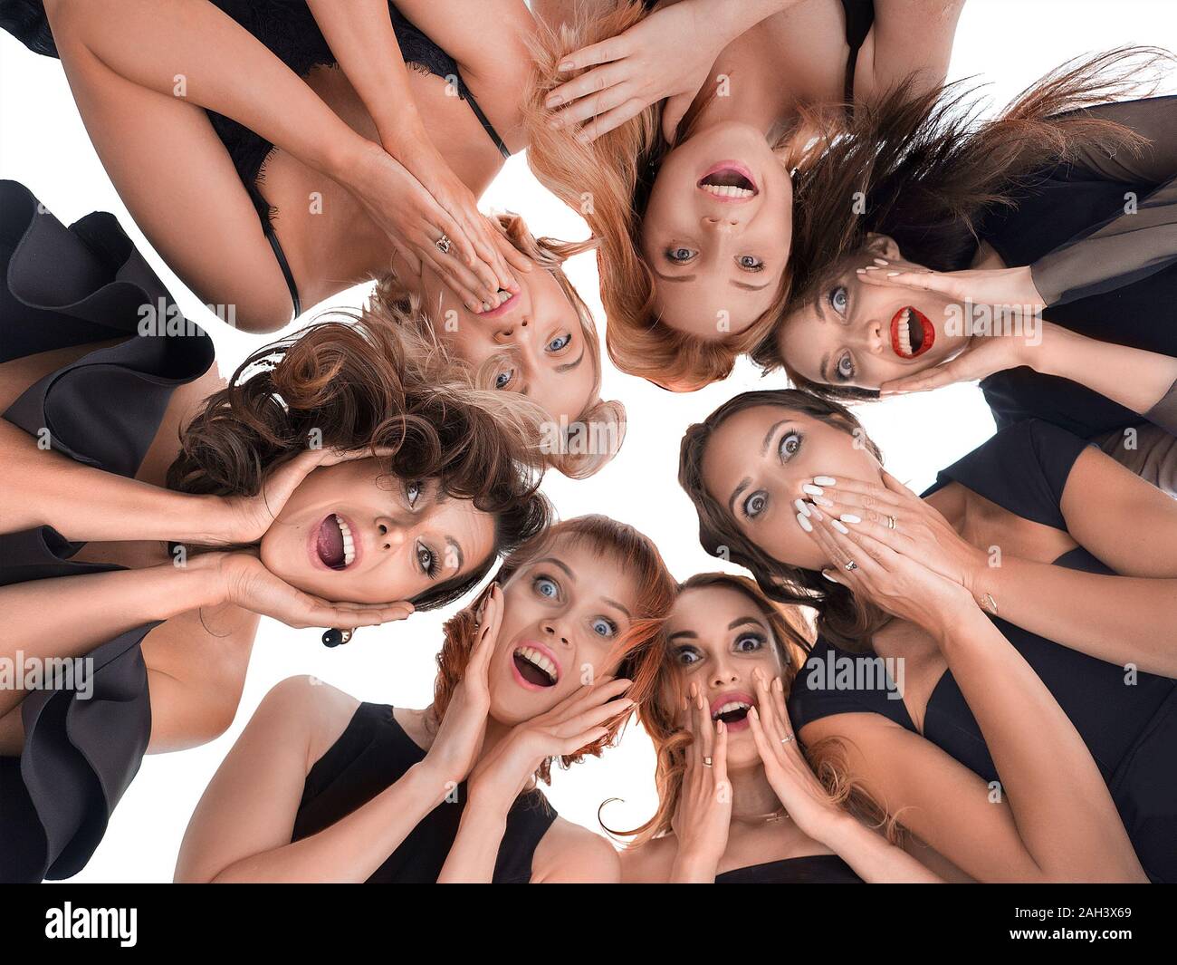 Group of happy amazed women. Surprized and looking down. Bottom view ...