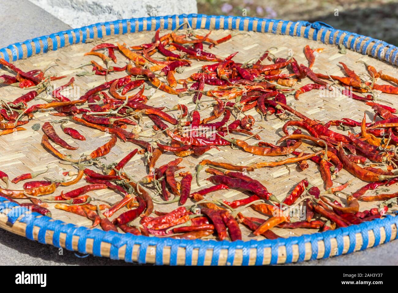 Chili peppers drying in sun hi-res stock photography and images - Alamy