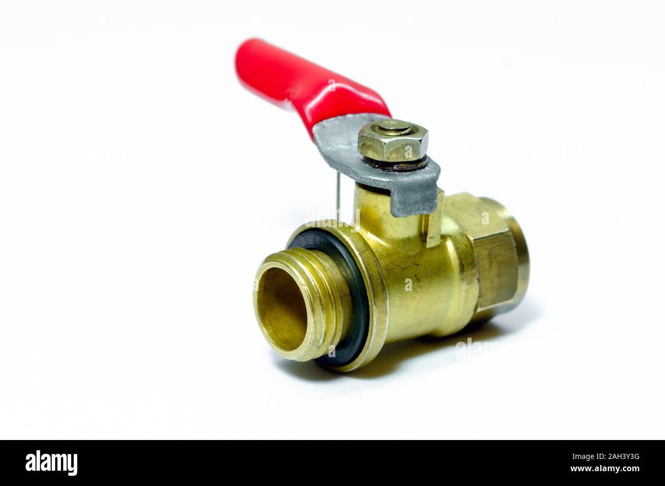 Plumbing brass connection fixtures and piping parts on white background ...