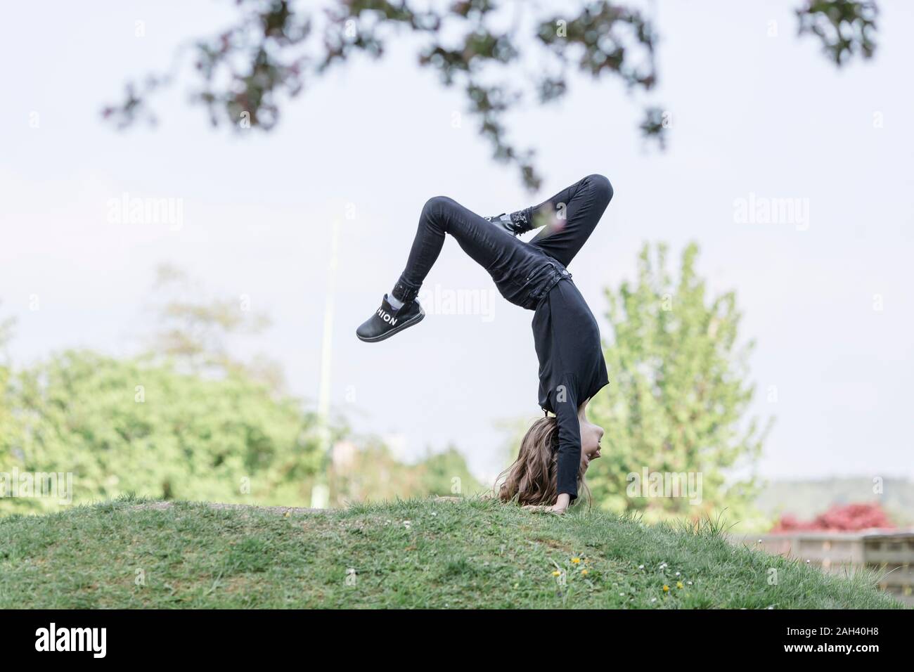 Girl doing handstand hi-res stock photography and images - Alamy