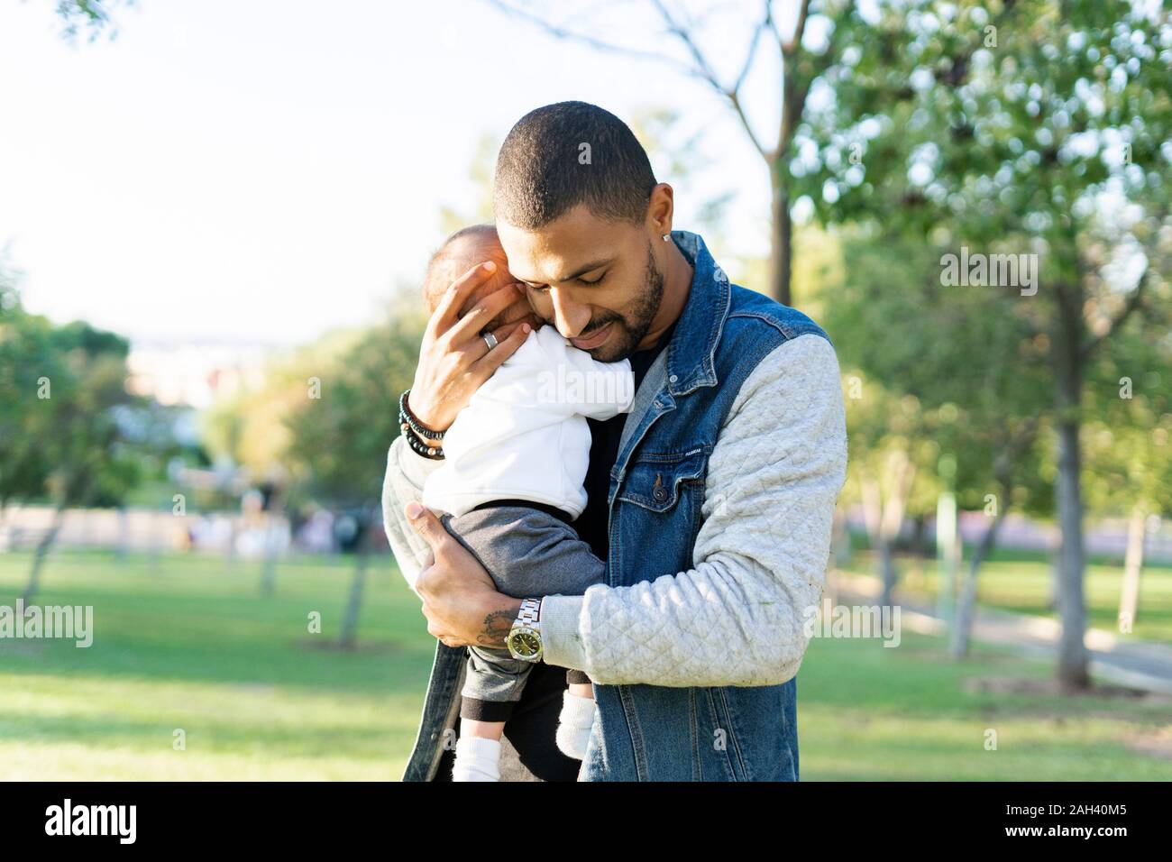 African man carrying baby in hi-res stock photography and images - Alamy