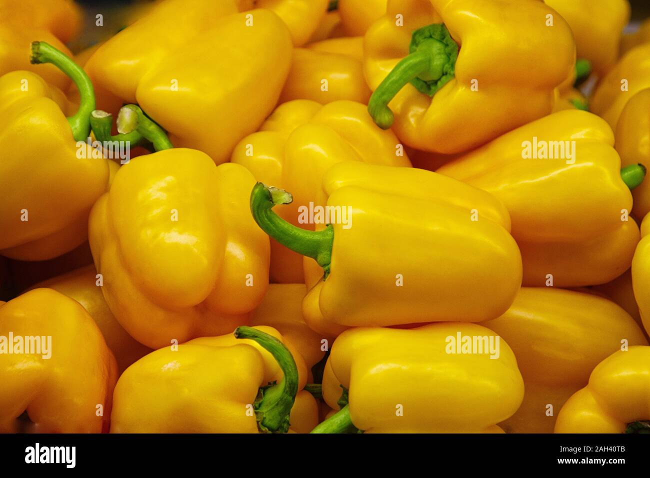 Fresh yellow pepper lying on the market counter. Yellow pepper texture ...