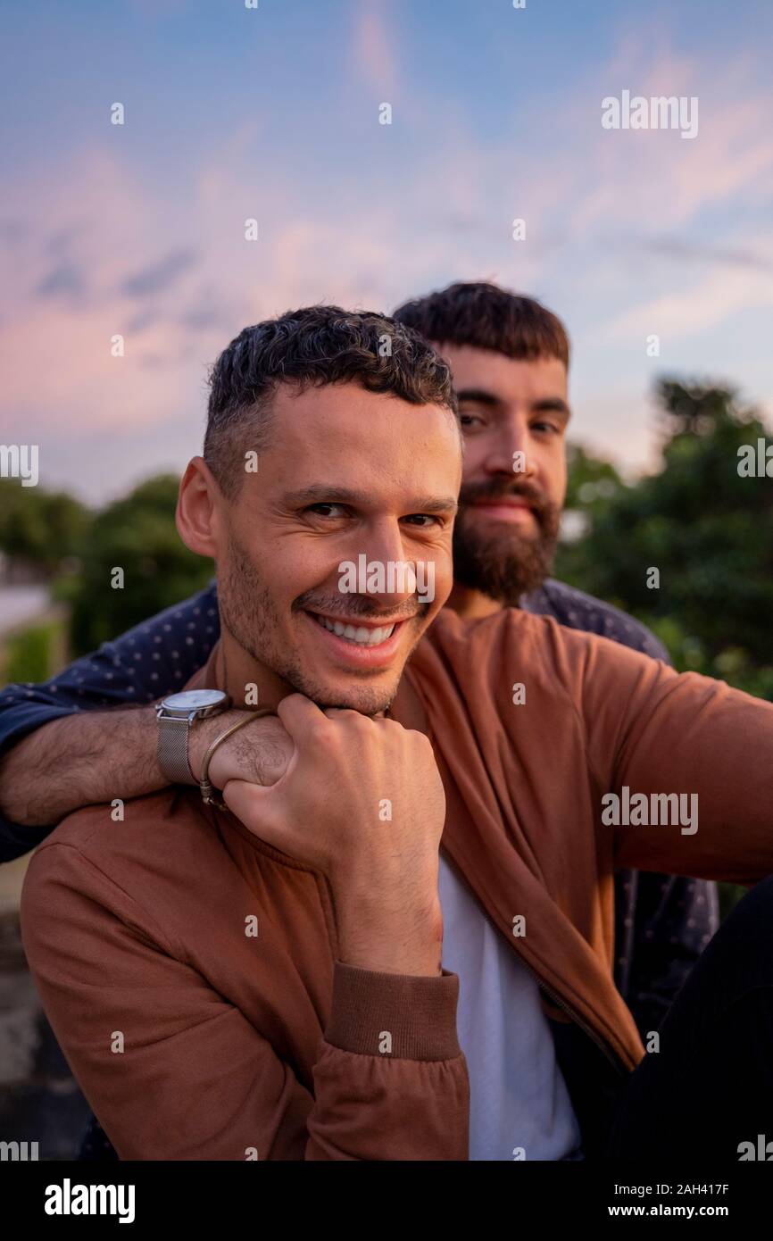 Happy gay couple cuddling on hi-res stock photography and images - Alamy