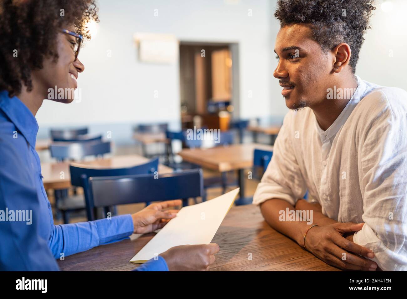Students discussing paper hi-res stock photography and images - Alamy