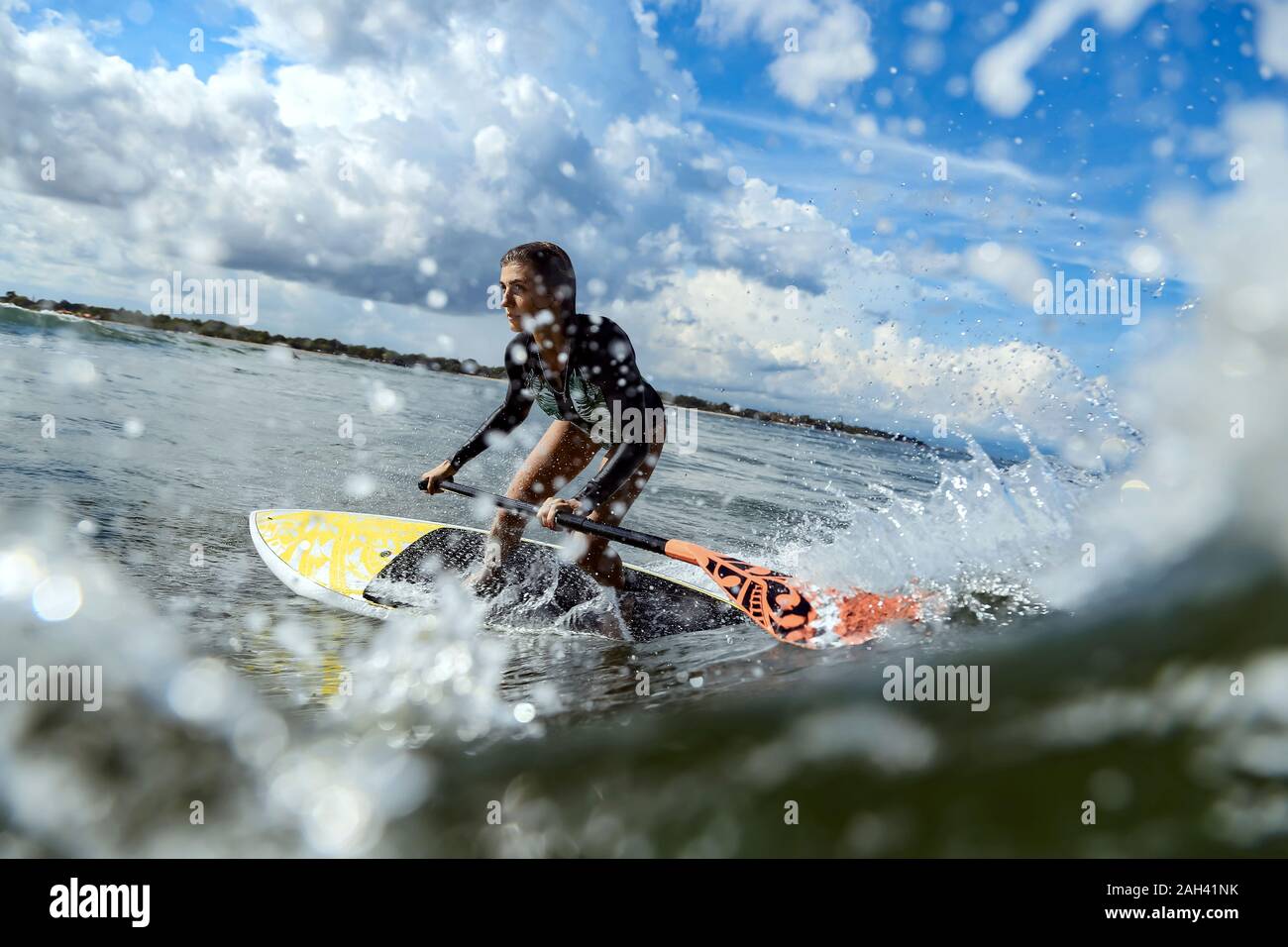 Female SUP surfer, Bali, Indonesia Stock Photo - Alamy