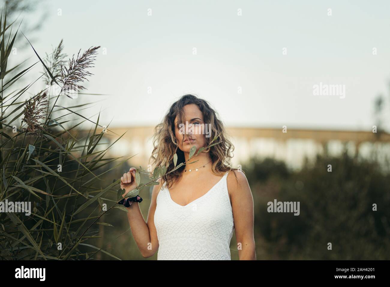 Portrait of sad woman wearing white summer dress Stock Photo - Alamy