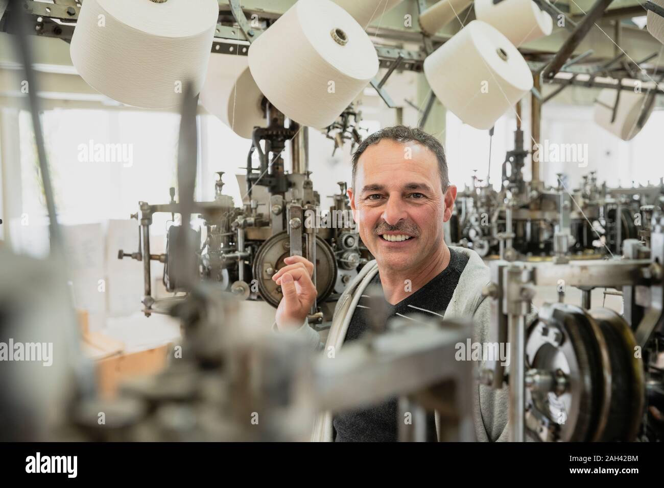 Portrait of the owner of a circular knitting mill Stock Photo - Alamy