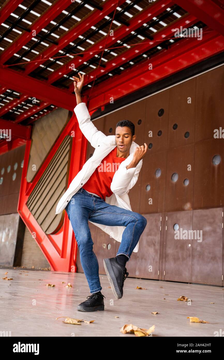 Young man moving and dancing outdoors Stock Photo - Alamy