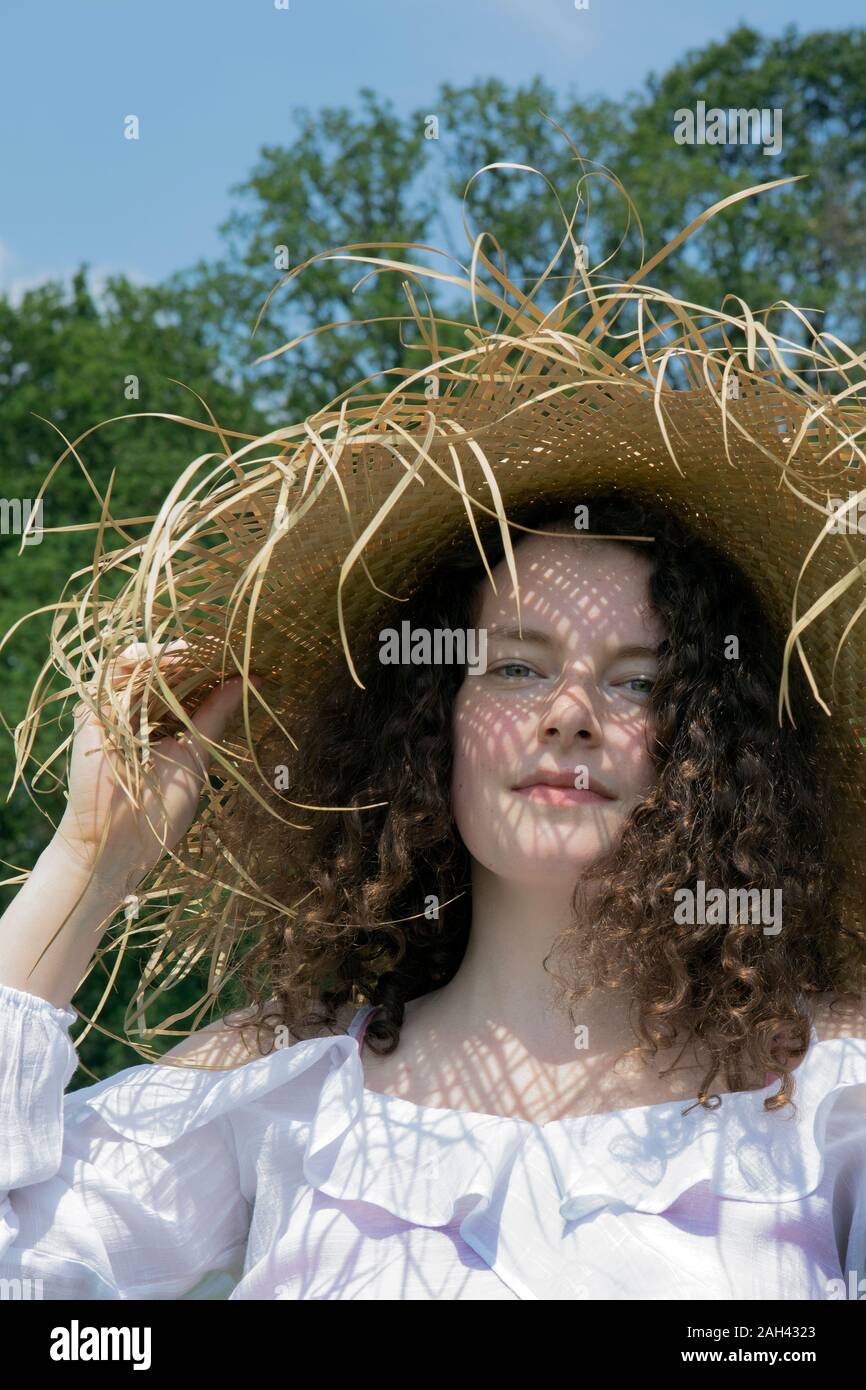 Frayed straw hat hi-res stock photography and images - Alamy