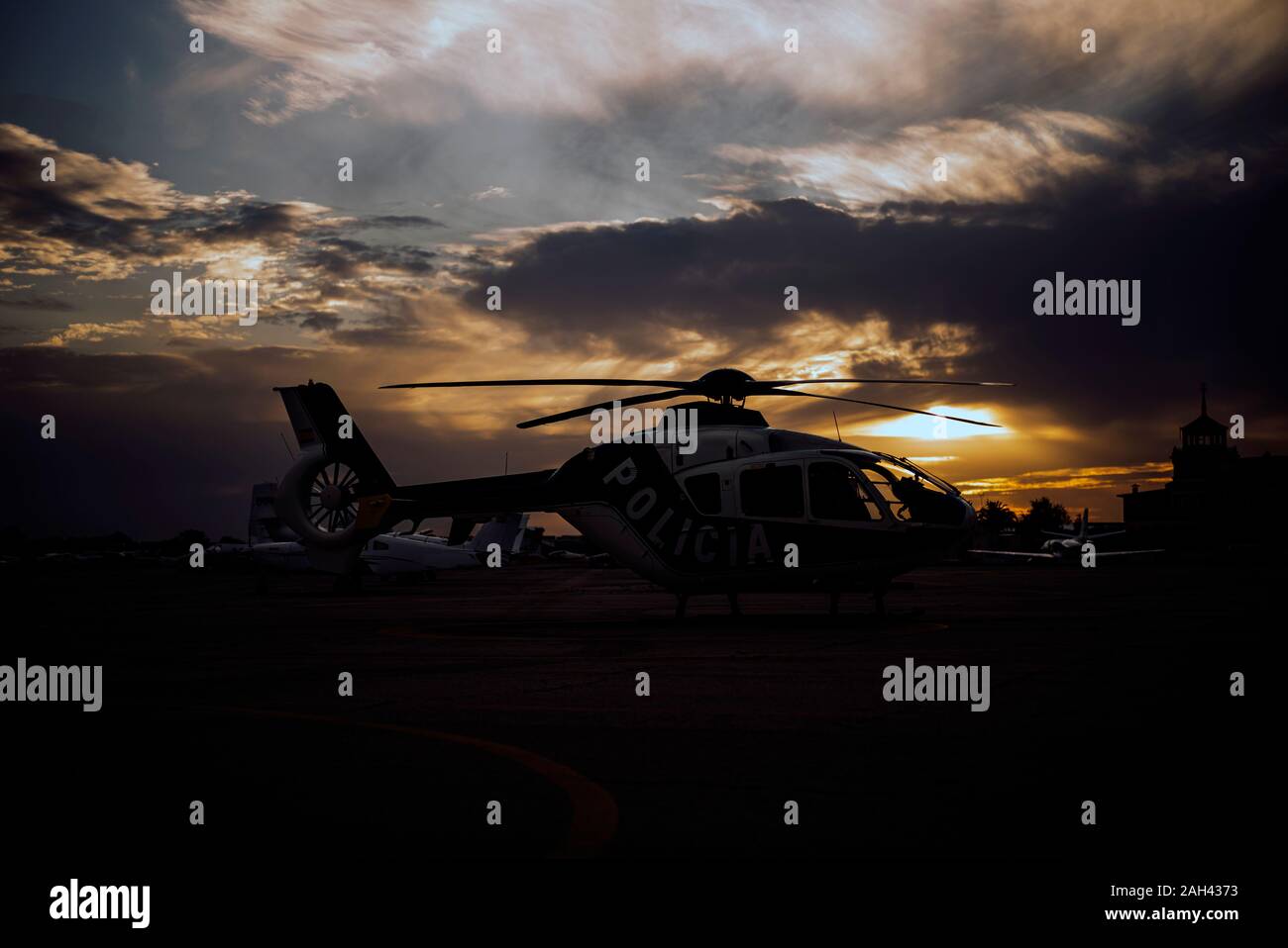 Spain, Madrid, Silhouette of police helicopter in helipad at dawn Stock ...