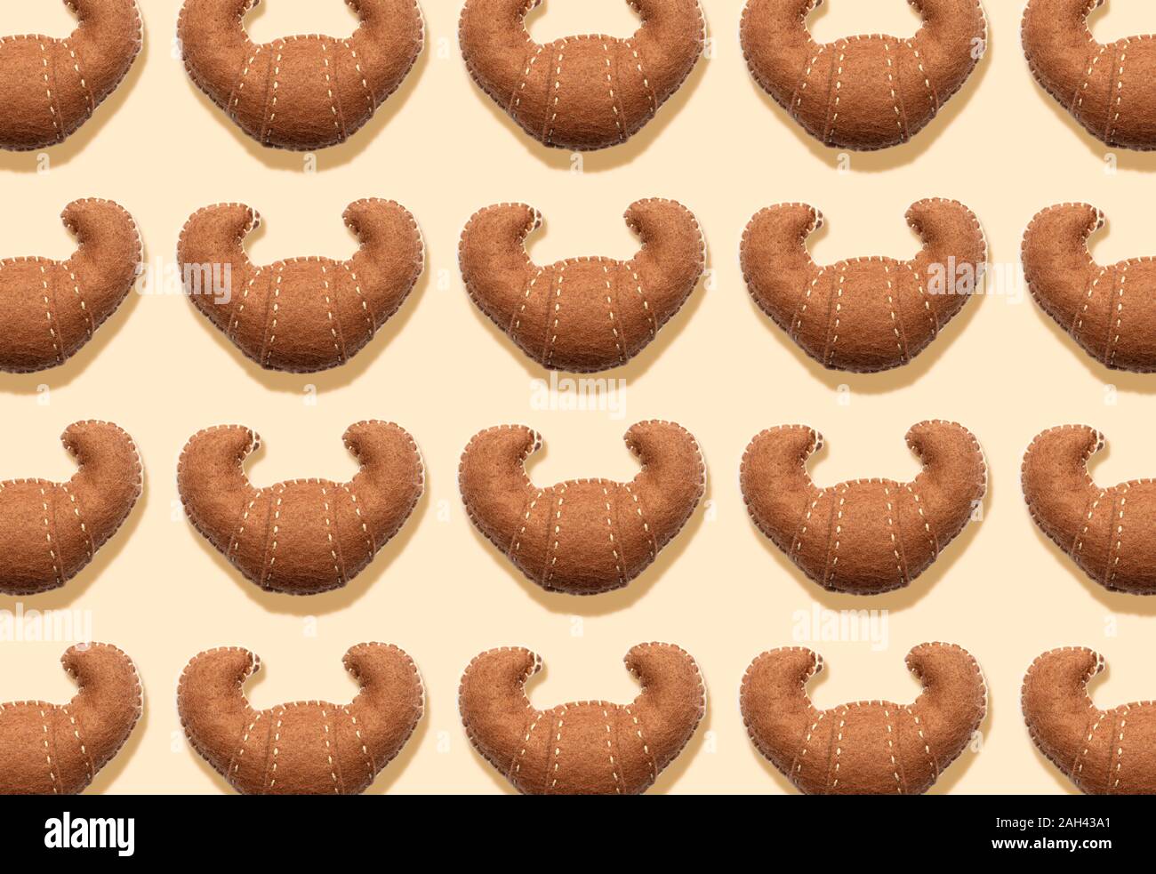 3D Illustration, Plush fake croissants pattern on cream background ...