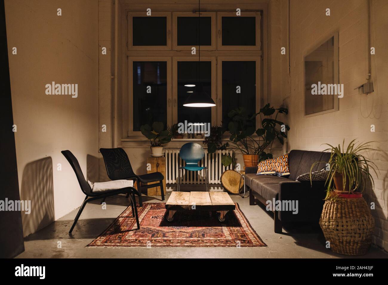 Lounge room in an office at night Stock Photo - Alamy