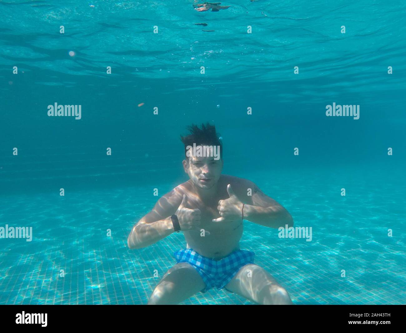 Man diving in pool hi-res stock photography and images - Alamy