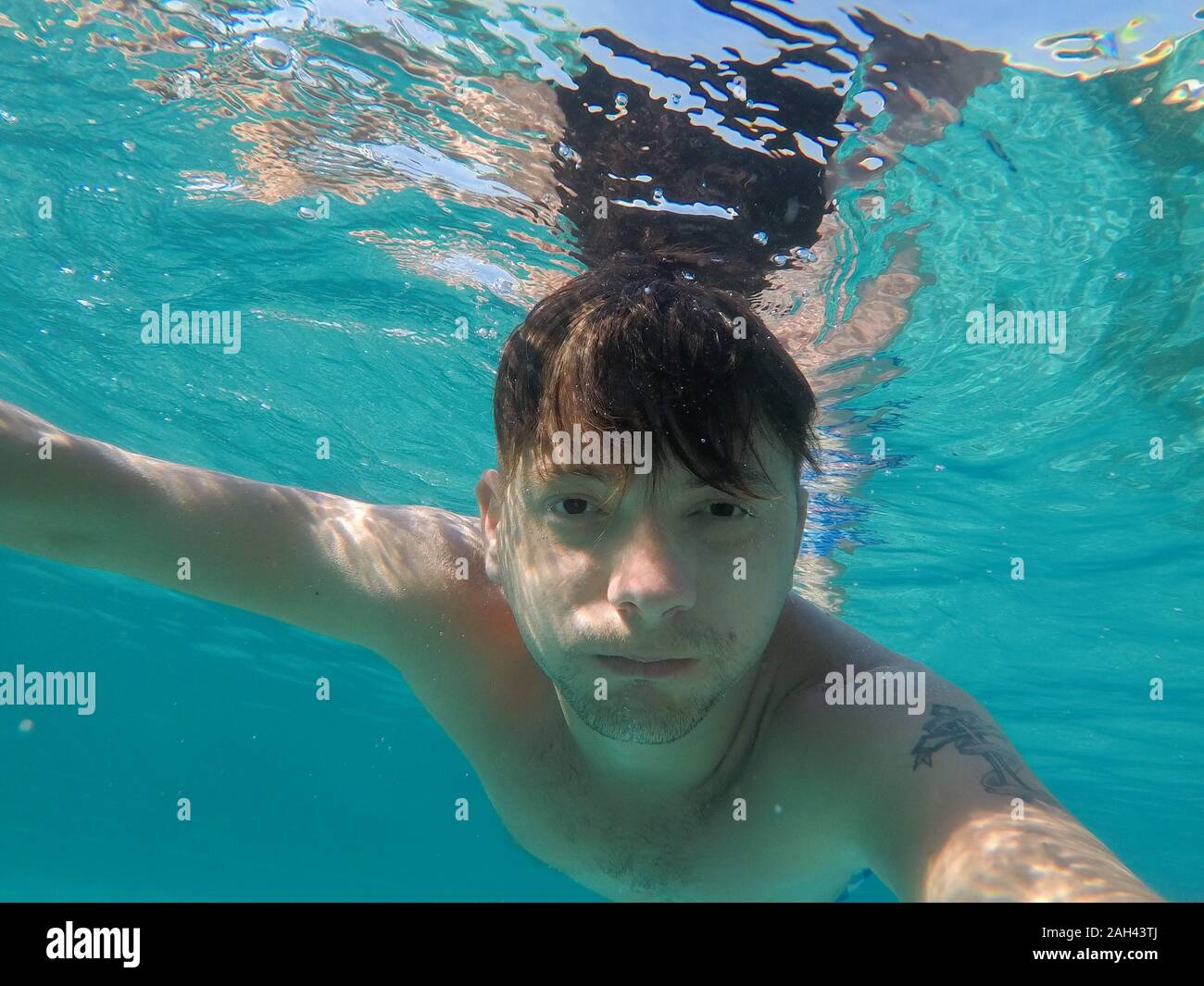 Male diving into sea hi-res stock photography and images - Alamy