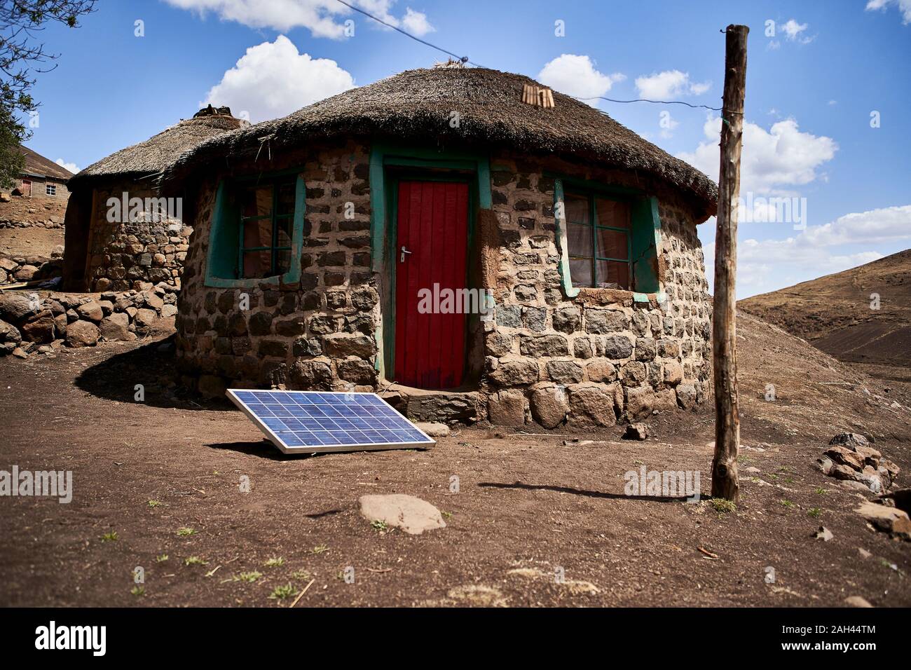 Traditional house with a solar panel, Lesotho Stock Photo - Alamy
