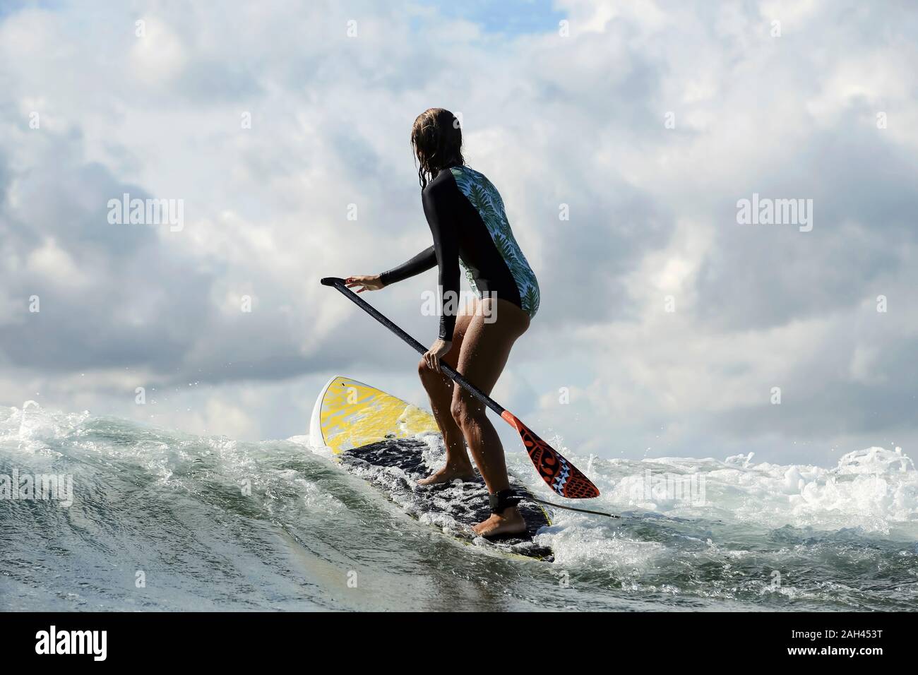 Female SUP surfer, Bali, Indonesia Stock Photo - Alamy