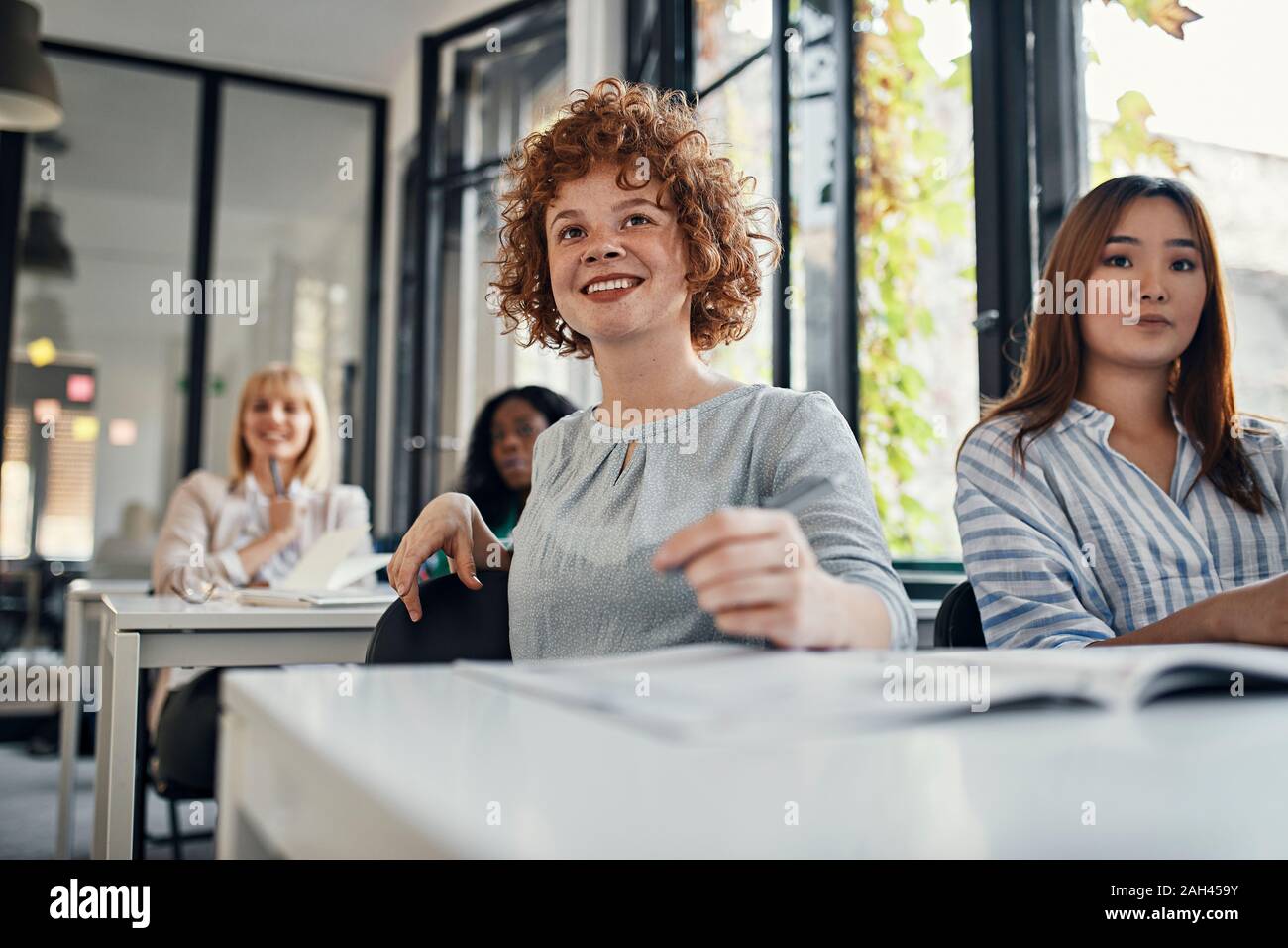 Businesswomen attending a workshop in conference room Stock Photo - Alamy