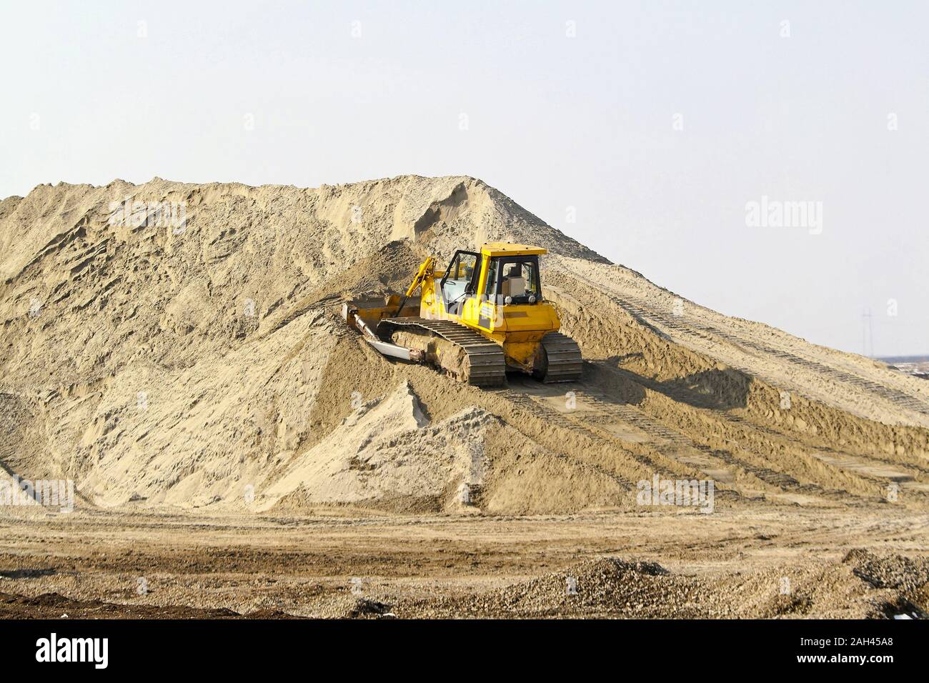 Bulldozer with track move sand at construction site Stock Photo - Alamy
