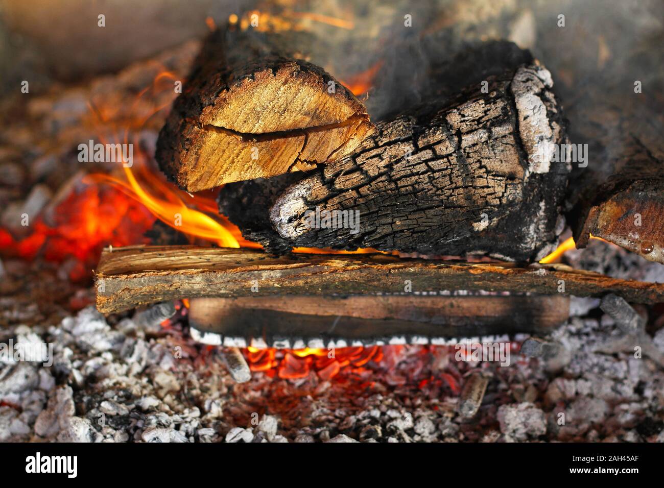 Wood log fire in fireplace Stock Photo - Alamy