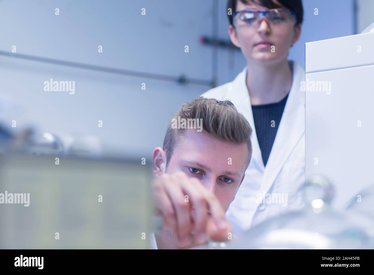 Female and male laboratory technician working together in a laboratory ...