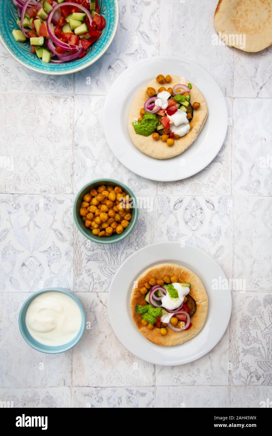 Israeli sabich with pita bread, eggplant, chick-peas, onion, tomato ...