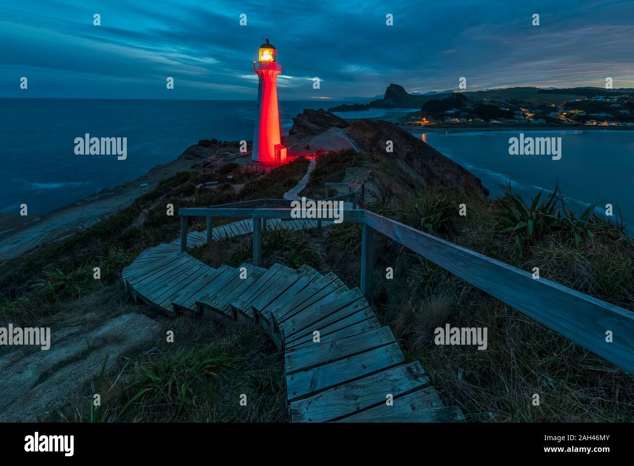 Illuminated lighthouse at dusk, Castlepoint, New Zealand Stock Photo ...