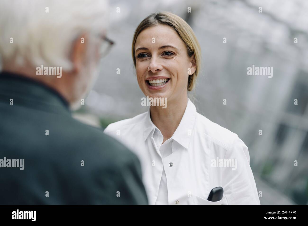 Portrait senior friendly doctor talking hi-res stock photography and ...