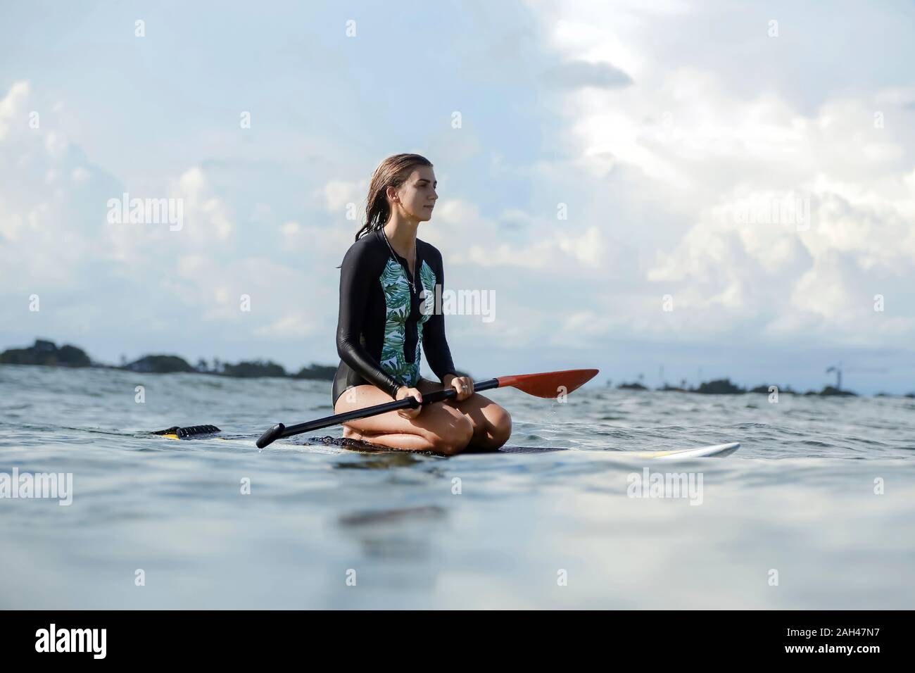 Female SUP surfer, Bali, Indonesia Stock Photo - Alamy