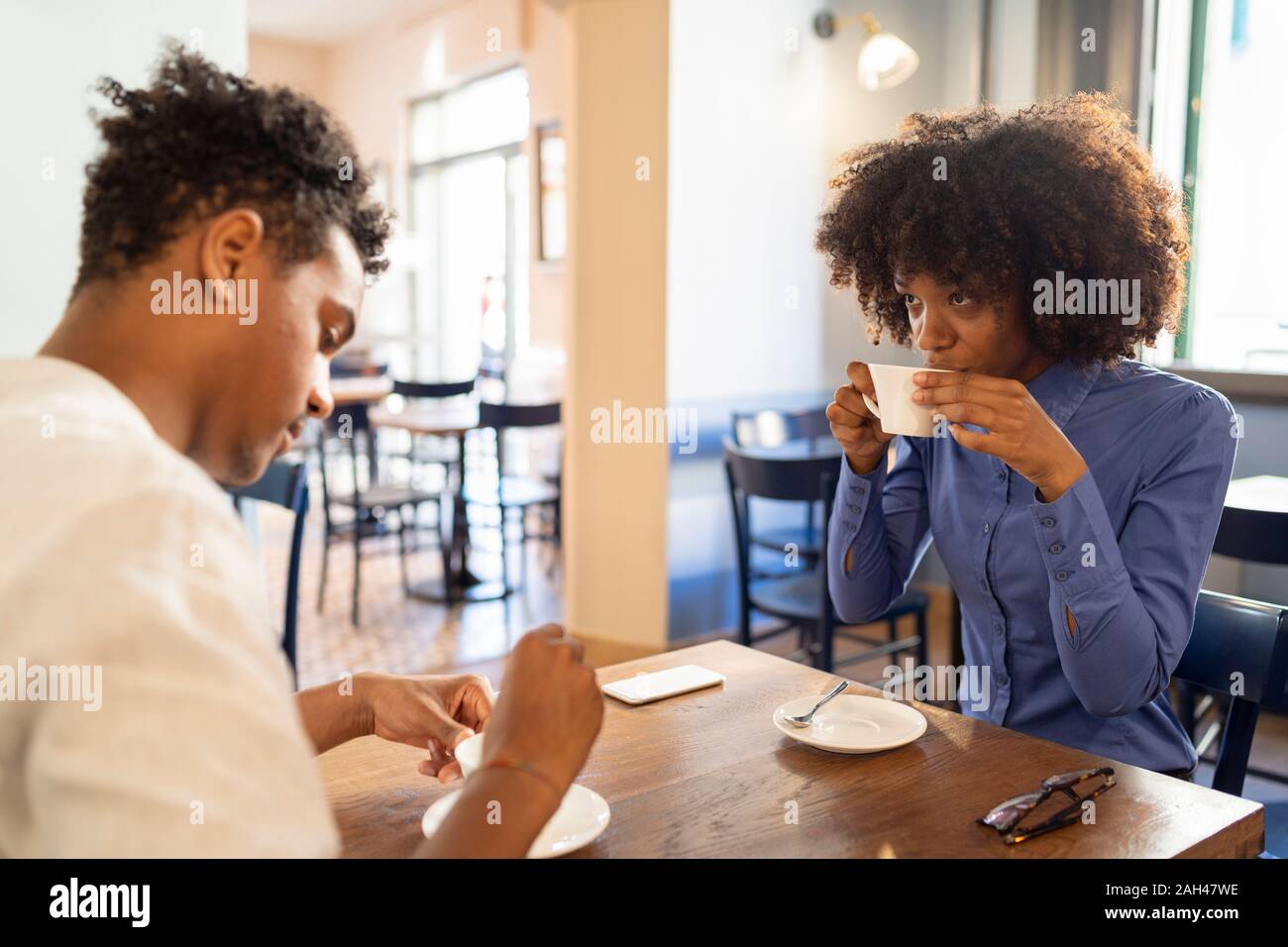 Students drinking coffee in a cafe Stock Photo - Alamy
