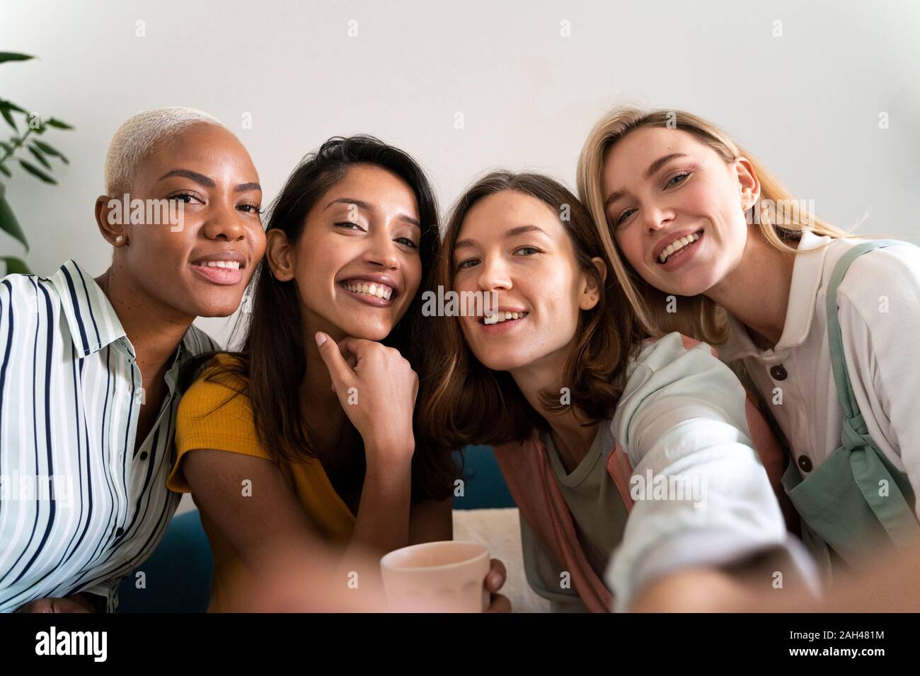 Self portrait of four smiling women Stock Photo - Alamy