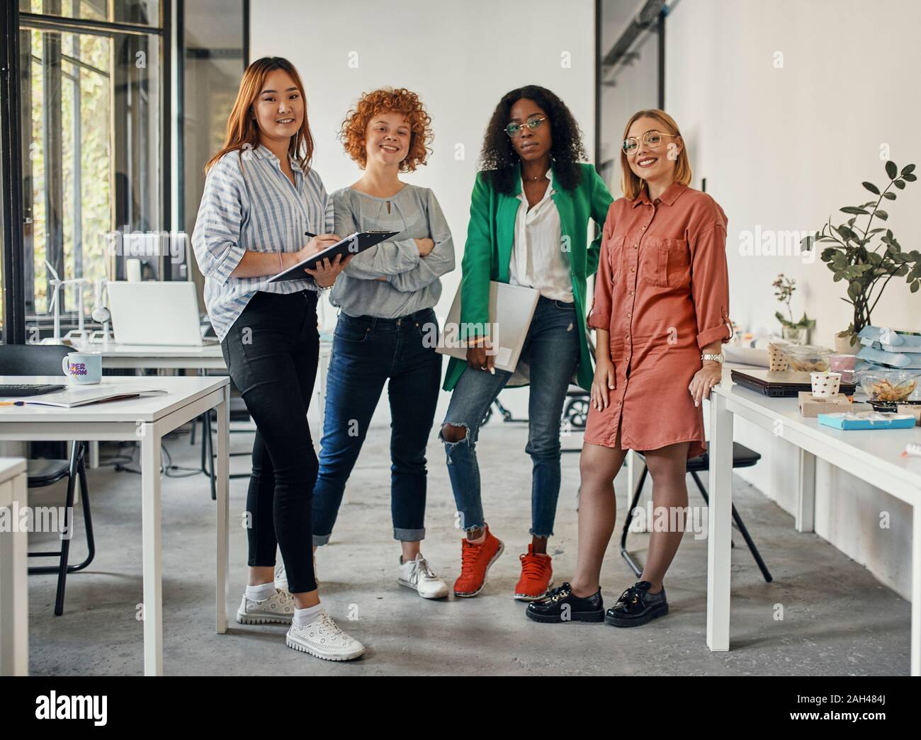 Portrait of confident female business team in office Stock Photo - Alamy