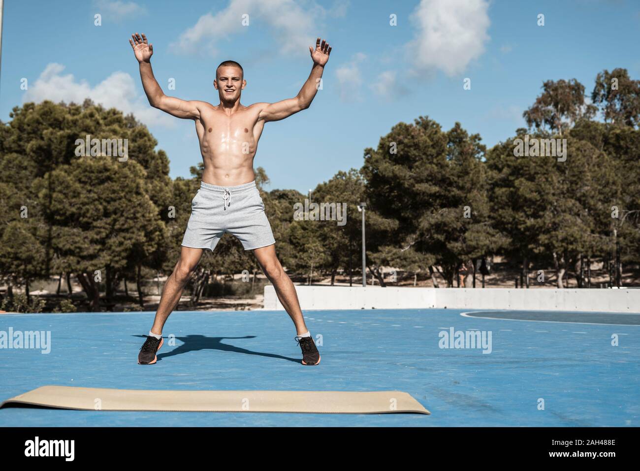 Portrait Of Barechested Muscular Man Practicing Fitness Exercises