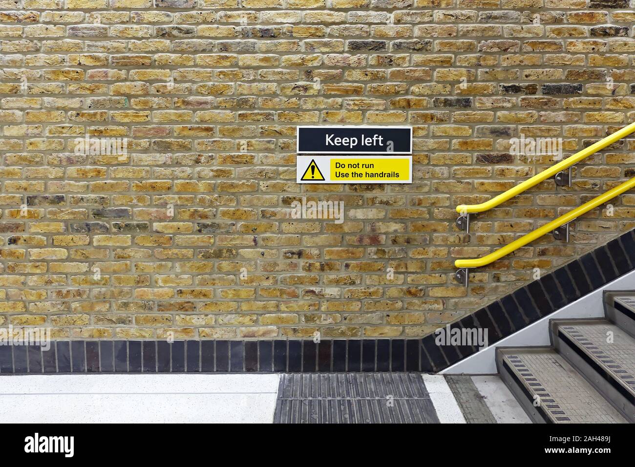 Keep left direction sign in public corridor Stock Photo - Alamy