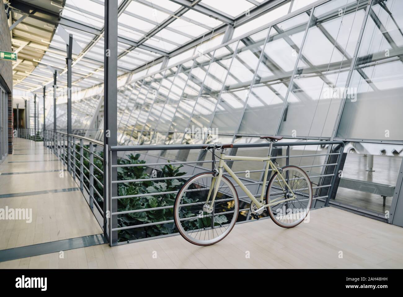 Bicycle in a modern office building Stock Photo - Alamy