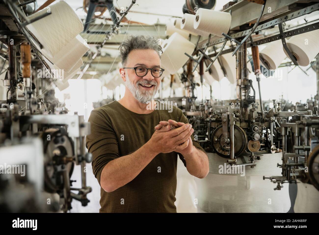 Producer of a fashion label during control in circular knitting mill ...