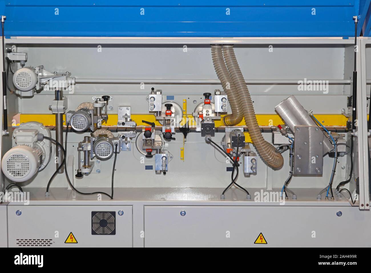 Machine for plank boards in wood working shop Stock Photo - Alamy