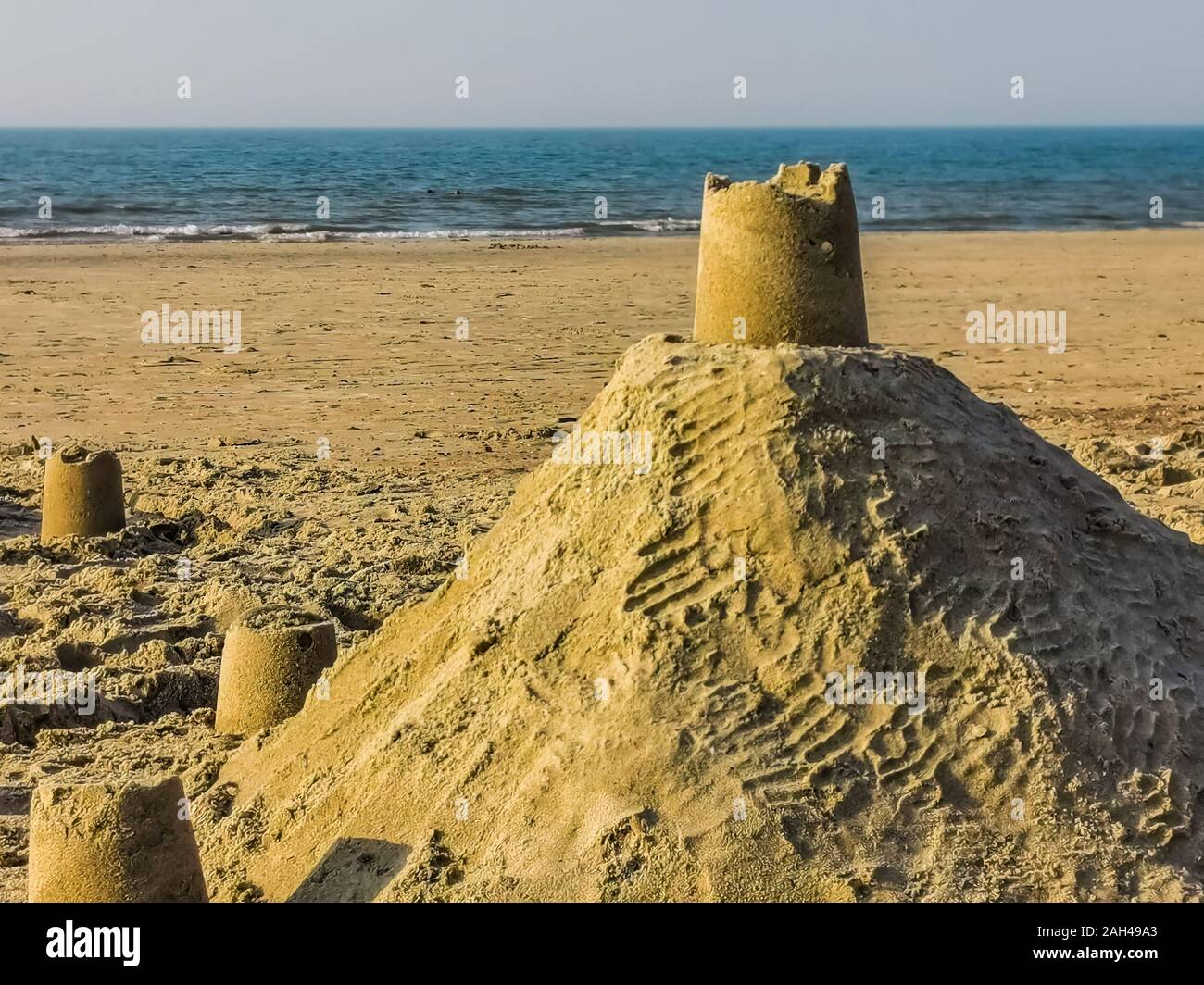 Children building a sand castle hi-res stock photography and images - Alamy