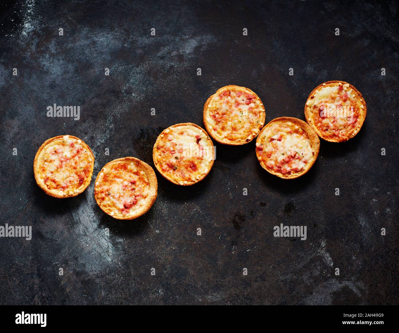 Six mini cheese pizzas Stock Photo - Alamy