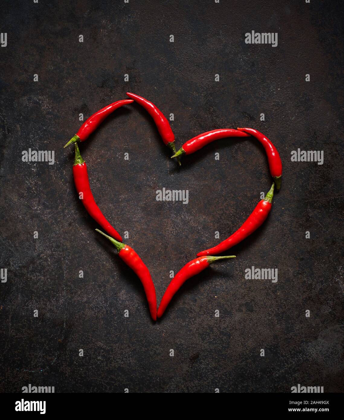 Hot chilli in heart shape hi-res stock photography and images - Alamy