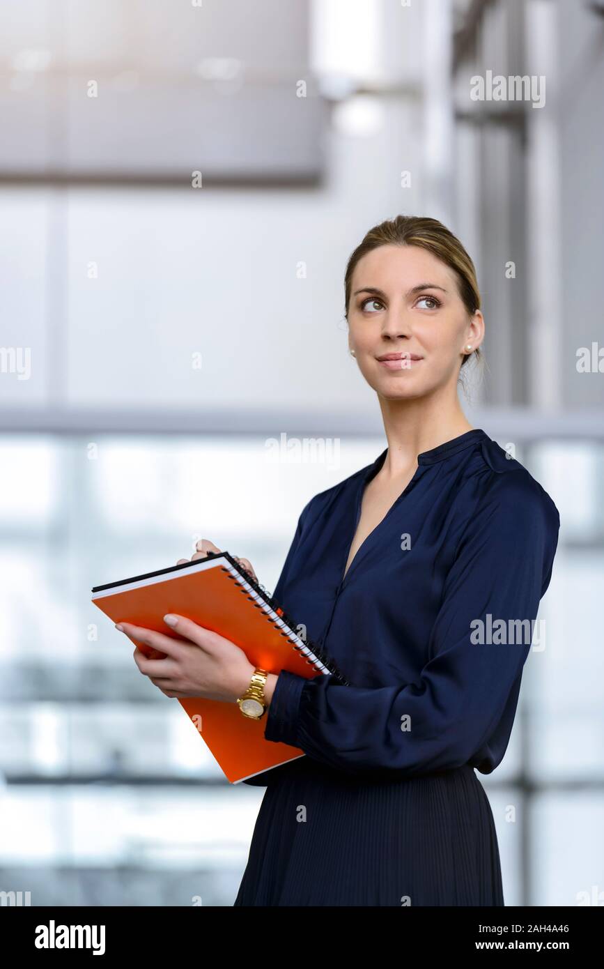 Women with ring binder hi-res stock photography and images - Alamy